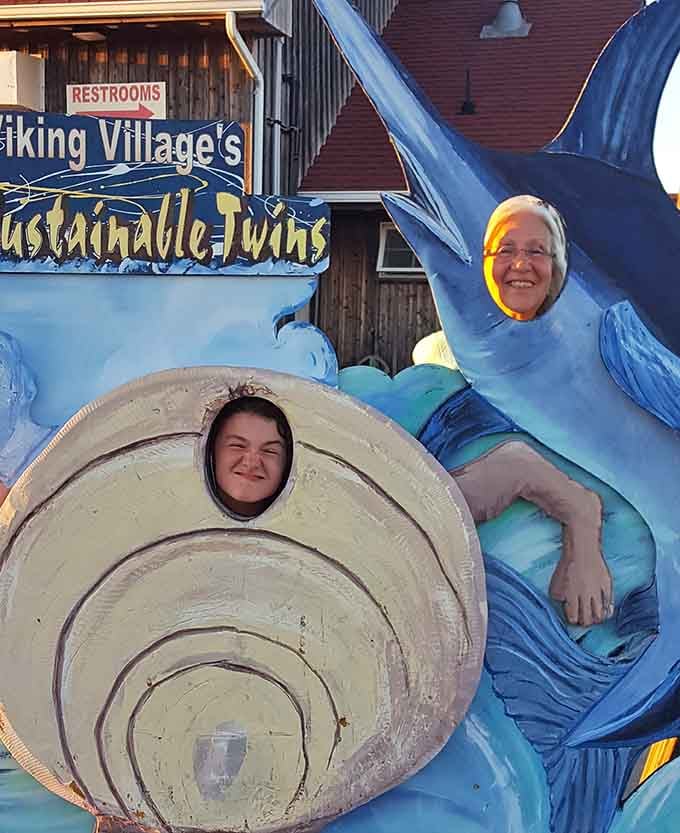 Nothing says "I visited a real fishing village" quite like sticking your face through a giant clam shell.