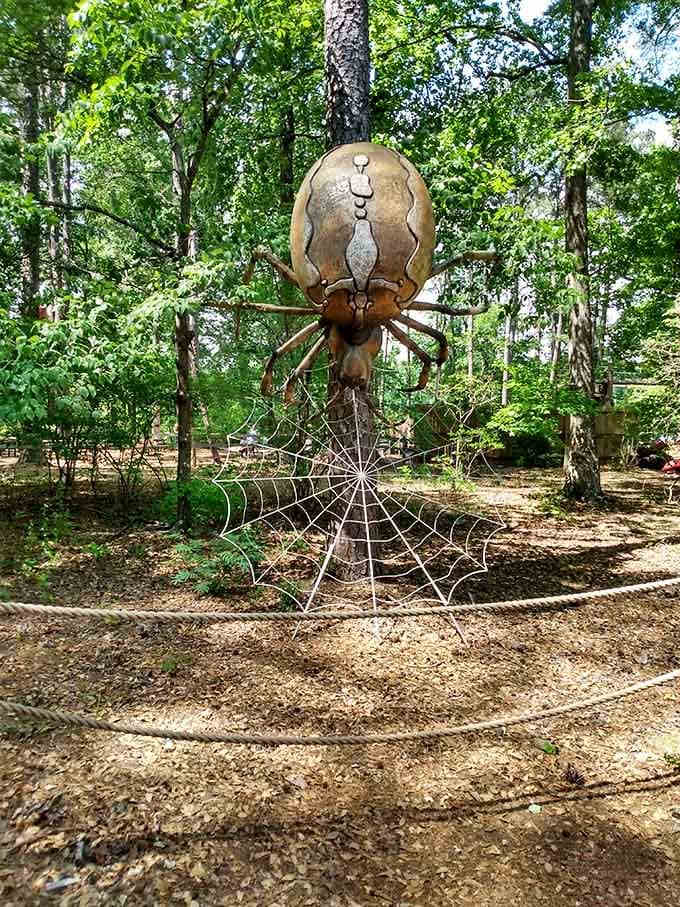 A giant spider sculpture lurking among the trees — educational, artistic, and just slightly terrifying in the best possible way.