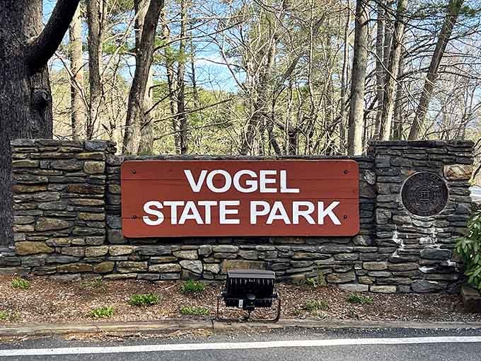 The stone entrance sign alone tells you something special is waiting just beyond those trees.