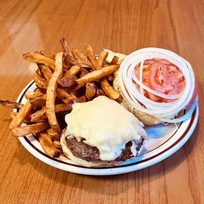 Melted cheese draped over a fresh-ground quarter-pounder with a mountain of hand-cut fries, this is what happiness looks like on a plate.