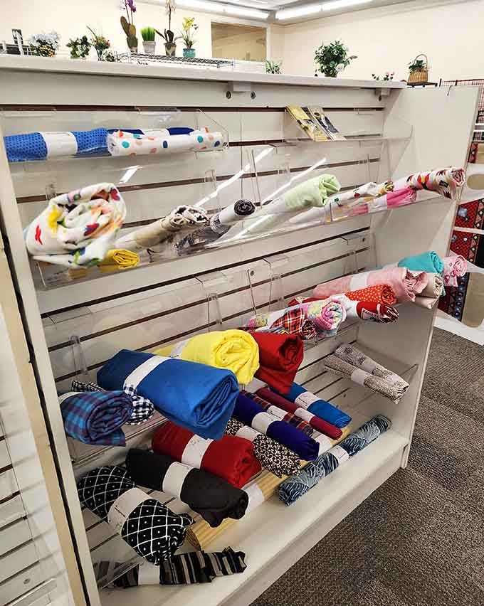 Fabric rolls stacked neatly, ready to become quilts, curtains, or whatever your creative heart desires.