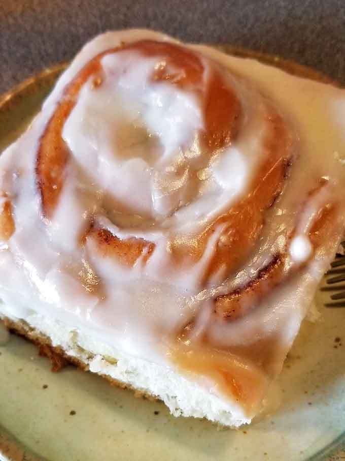 This cinnamon roll isn't just breakfast. It's a commitment, a conversation, and possibly a life-changing moment on a plate.