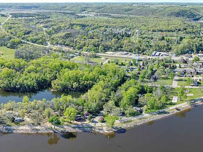 From above, the winding river embraces this green valley like nature's own welcoming hug.