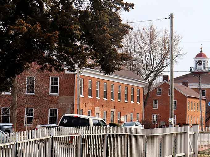 Bishop Hill's cluster of 19th-century brick buildings stands behind a white picket fence like a living postcard from another century entirely.
