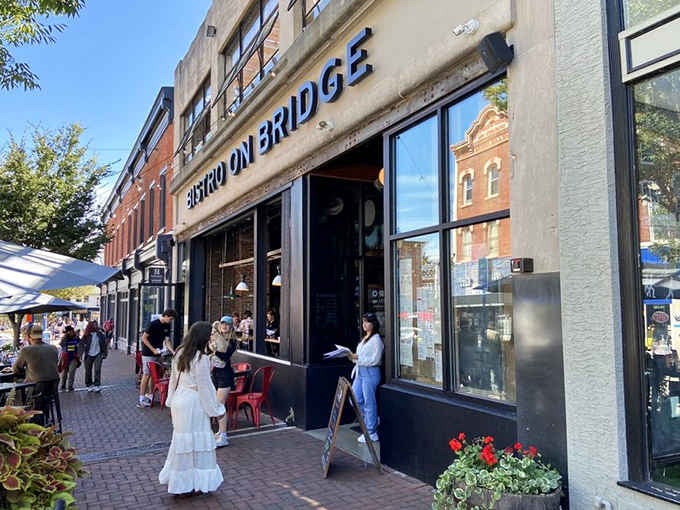 Red chairs, brick sidewalks, and a bold sign signal that something delicious is waiting just inside.