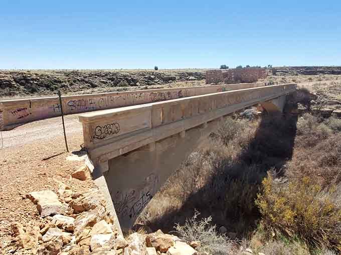 This graffiti-tagged bridge over Canyon Diablo has seen more drama than a prime-time soap opera, and the canyon below agrees.
