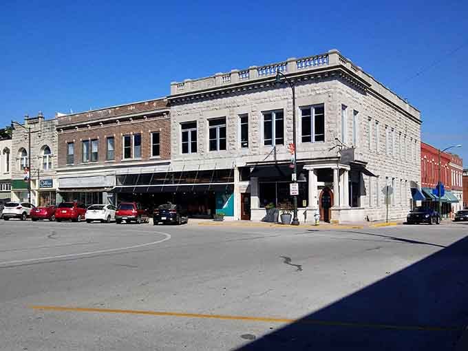Carthage's downtown corner anchors itself with gorgeous gray limestone confidence, the kind of building that simply refuses to be ignored.