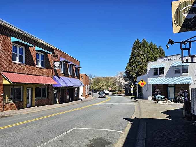 Blue skies frame brick buildings where every storefront holds the promise of unexpected treasures and friendly conversation.