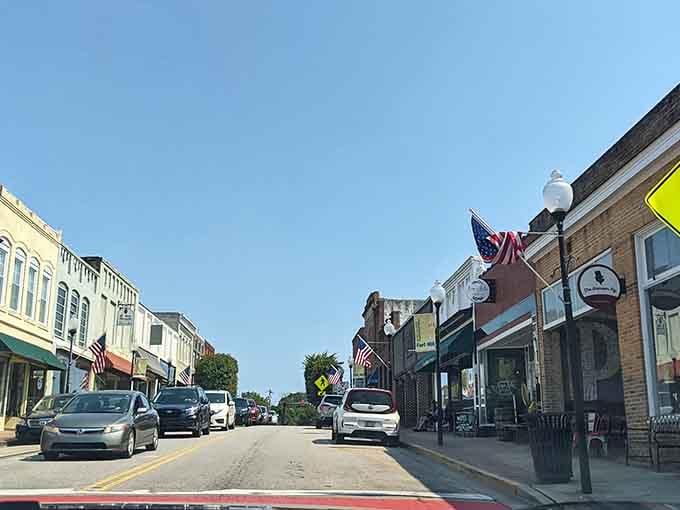 American flags line Fort Mill's sunny main street, giving the whole block a proud, festive energy.