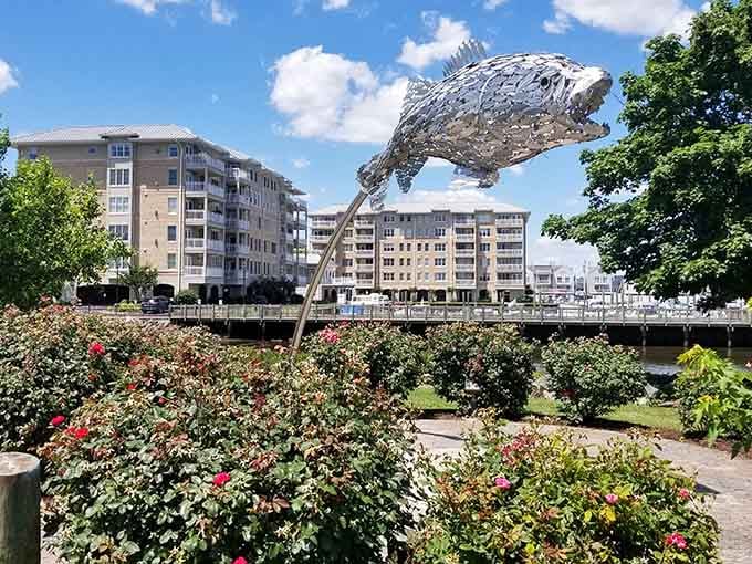 That glittering steel fish sculpture leaping above a garden of roses is Havre de Grace saying, "Yes, we're exactly this delightful."