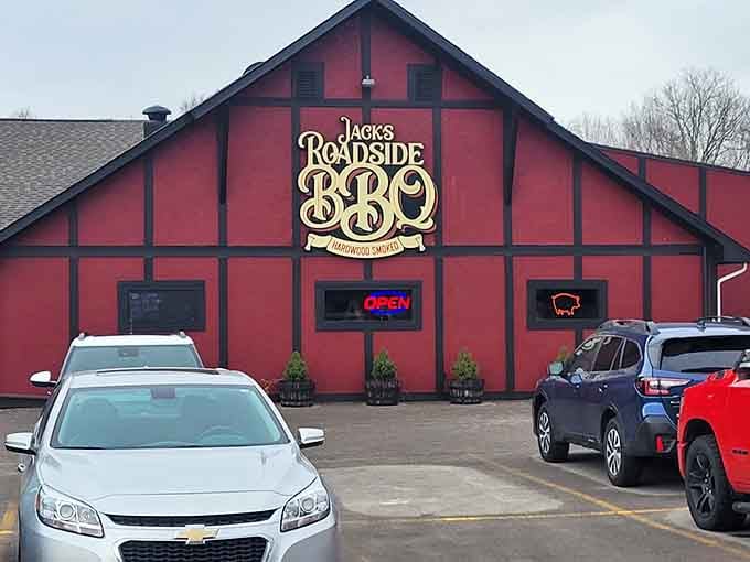 That red barn-style building with Tudor beams looks like it wandered in from Bavaria but serves pure American BBQ.