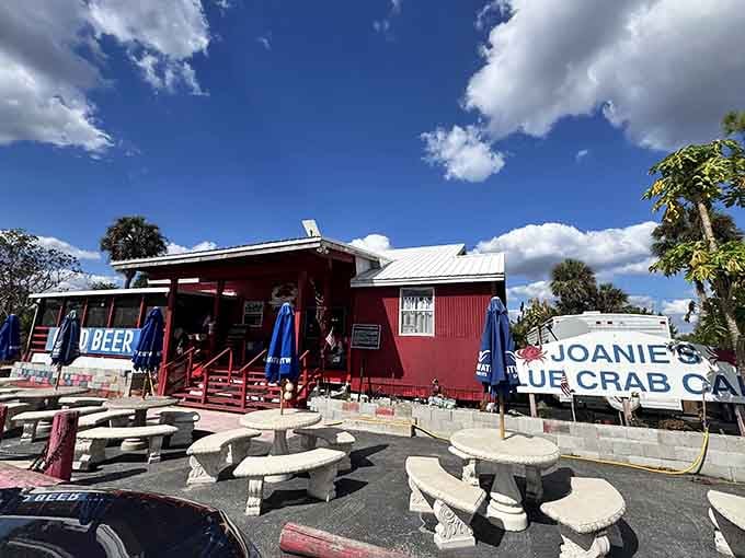 That bold red building under a wide open sky announces Joanie's Blue Crab Cafe like it means serious business, and it does.