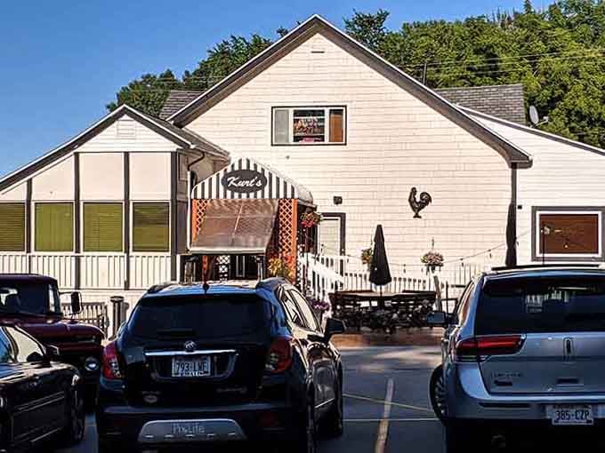 That cheerful striped awning and rooftop rooster at Kurt's give off serious "neighborhood favorite" energy, and the packed parking lot backs it up completely.