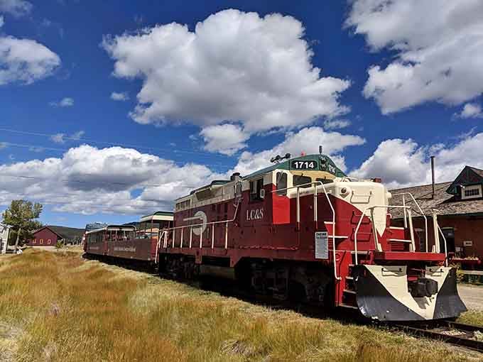 Engine 1714 sits bold and red against a sky so blue it looks painted, ready to climb toward the clouds.