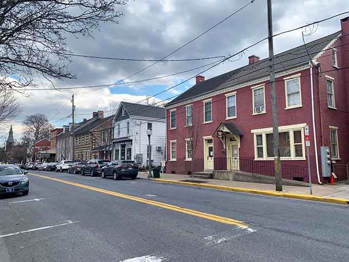 Historic row houses painted in warm hues create a streetscape that feels like coming home.