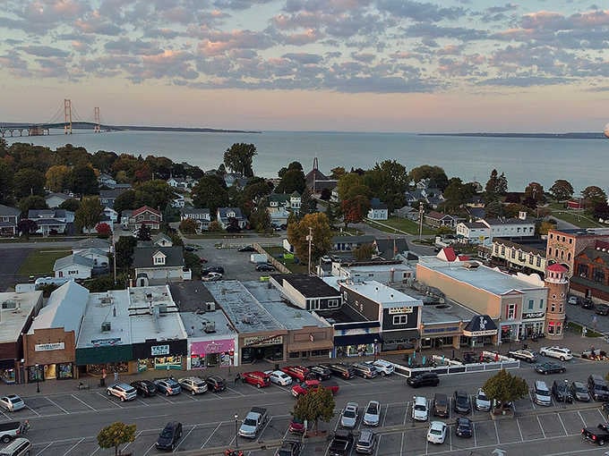 Mackinaw City at golden hour, with the mighty Mackinac Bridge glowing on the horizon like nature's own version of a standing ovation.