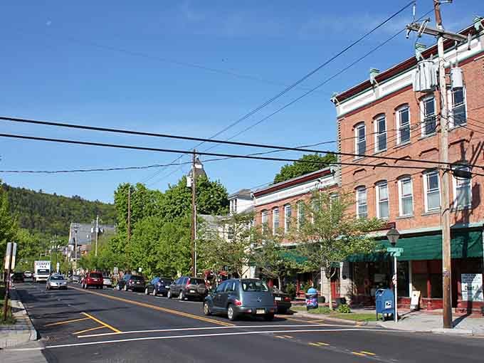 Tree-lined streets frame these historic buildings beautifully, creating the kind of scene Norman Rockwell would have loved painting.