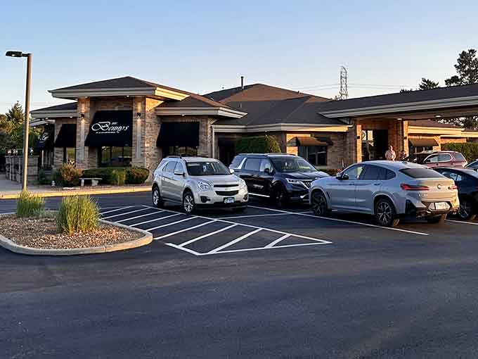 Golden hour light spills across the parking lot at Mr. Benny's, and somehow even the awnings look like they're dressed for a special occasion.