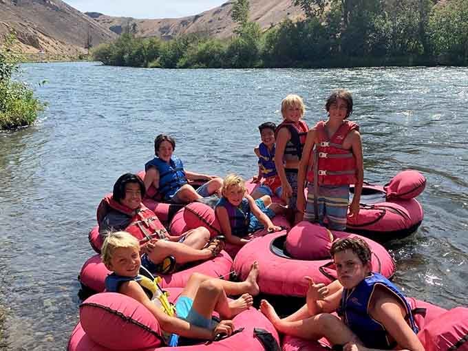 Safety vests in red and blue dot the water like confetti celebrating another perfect day on the river.