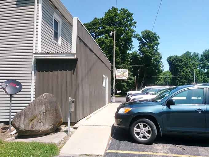 A giant boulder and a packed summer parking lot &mdash; the Old Tavern Inn clearly needs no fancy billboard.