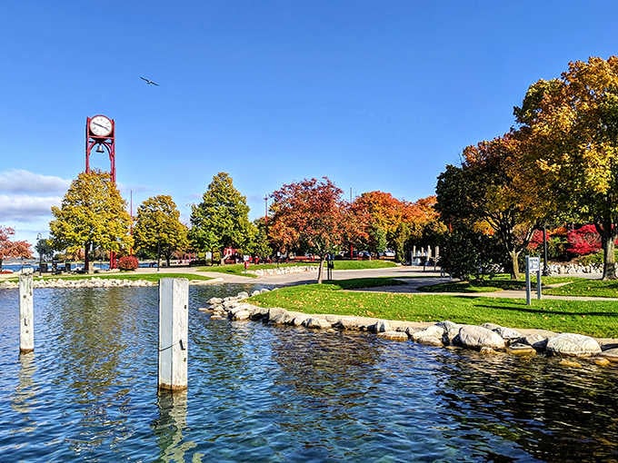 Petoskey's Bayfront Park clock tower stands guard over autumn trees so vivid they look almost too good to be real.