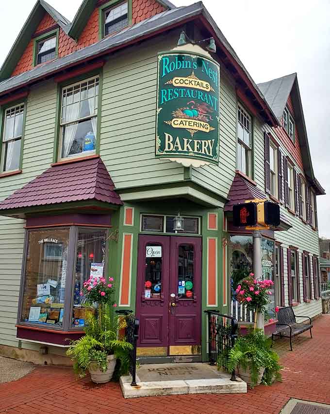 That painted Victorian corner building, bursting with flowers and color, looks like it wandered straight out of a fairy tale.