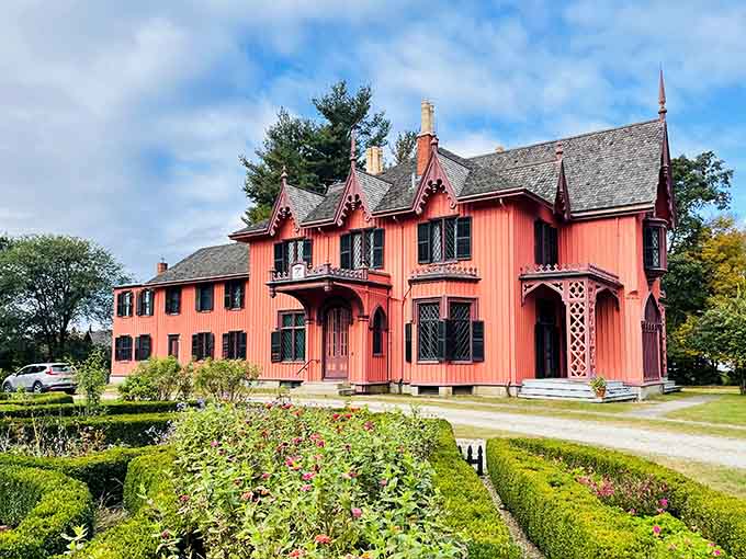 That salmon-pink Gothic Revival exterior is proof that Connecticut has always known how to make an entrance.