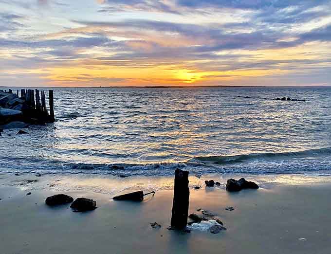 Weathered pilings catch the sunset like an impressionist painting, reminding us why we chase these coastal moments.