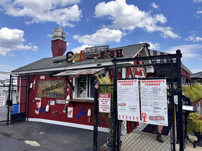 That hand-painted "Eat Fish" sign perched above a gate full of buoys and lobster decor is basically a masterpiece.