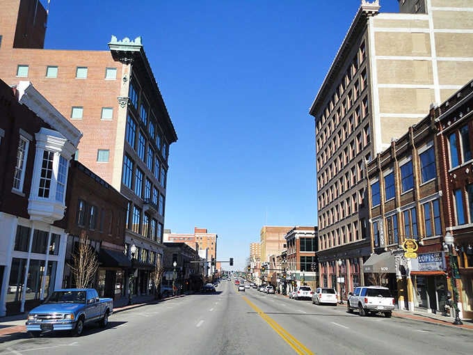 Webb City's downtown corridor stands tall and confident under a brilliant blue sky, its historic multi-story buildings telling a story of a town that never stopped believing in itself.