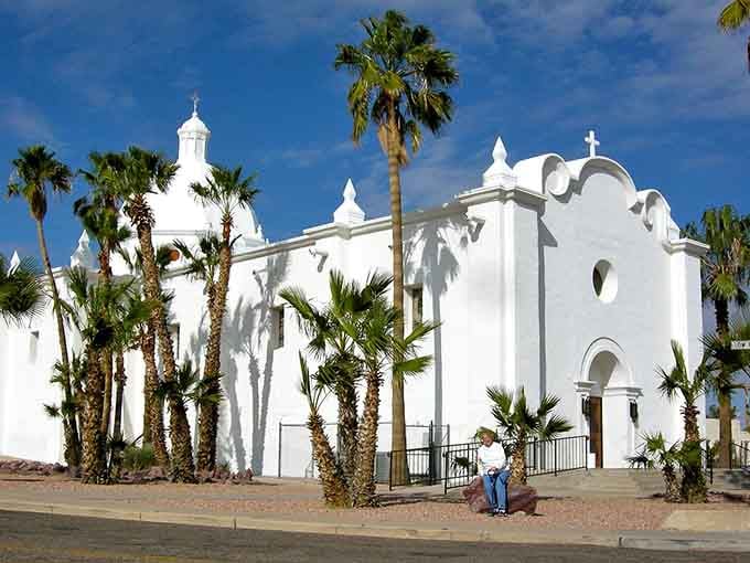 Brilliant white walls and swaying palms &mdash; Ajo's Immaculate Conception Church looks like a postcard painted by hand.