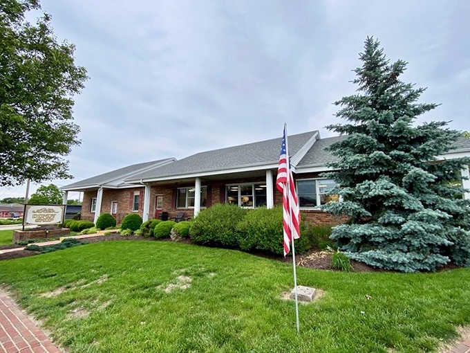 Fresh-cut lawn, a proud American flag, and donuts waiting inside, this place has its priorities perfectly in order.