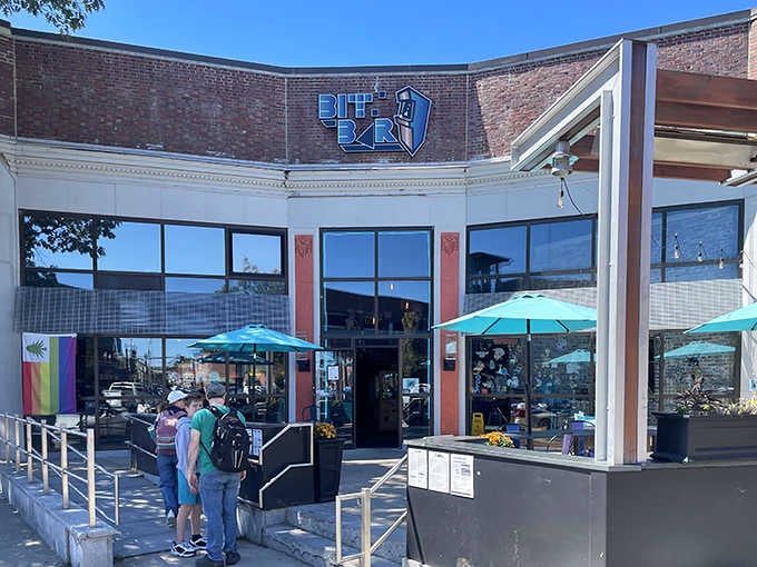 Bright blue umbrellas and sunny skies frame this corner spot where nostalgia comes with excellent food and games.