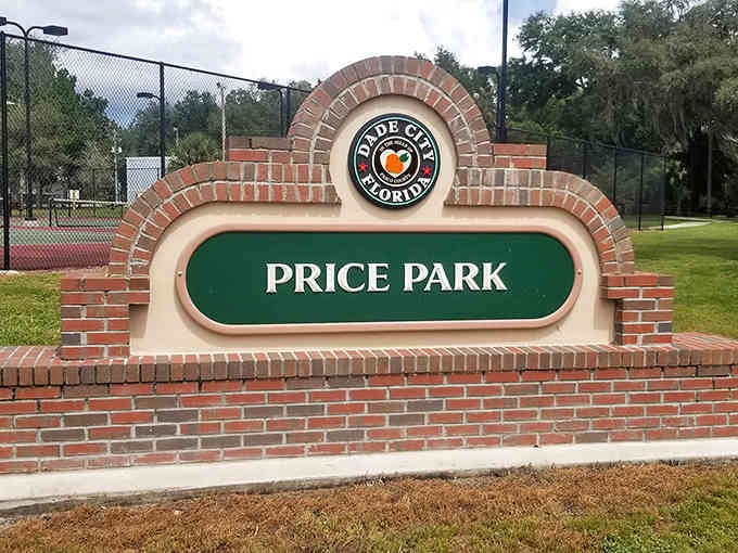 Price Park's brick entrance welcomes visitors with old-fashioned charm, promising green spaces and community gatherings just beyond the sign.