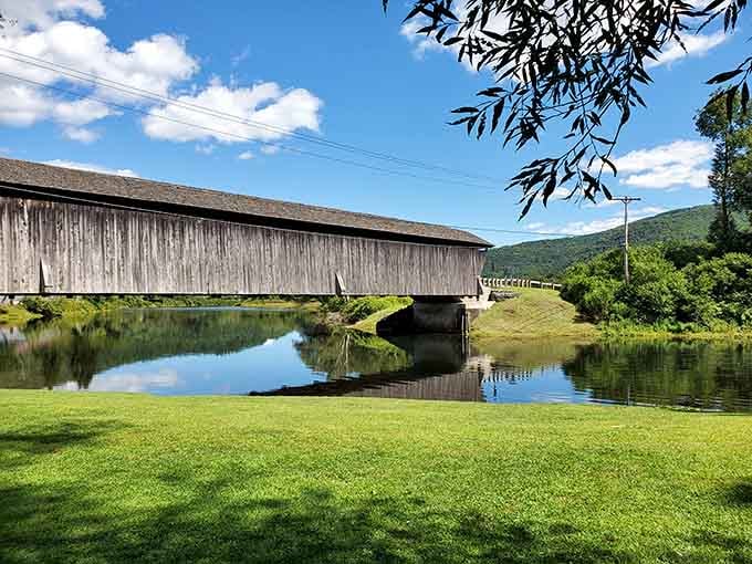 That mirror-perfect reflection in the calm water below makes you wonder which version of this bridge is the more beautiful one.
