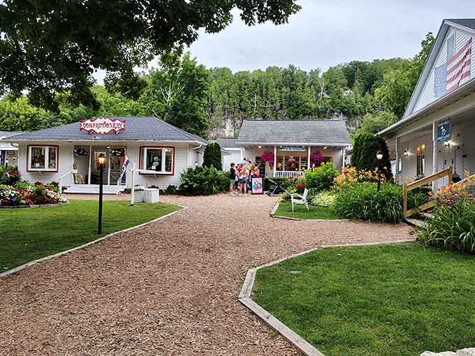 The flower-lined path leads to a porch that looks ready for rocking chairs, sweet tea, and absolutely no hurry whatsoever.
