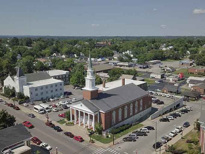 From up high, Harrodsburg's grand columned church anchors the whole town like a proud, white-steepled heartbeat.