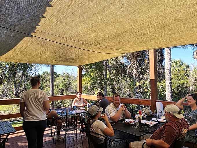 Shaded, relaxed, and surrounded by palms and sunshine &mdash; this outdoor deck at Joanie's is where the Everglades slows everyone down beautifully.
