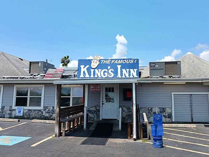 Up close, the bold blue "The Famous King's Inn" sign feels less like a boast and more like a well-earned promise.