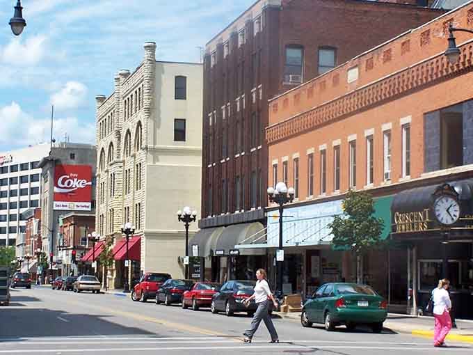 A bold Coca-Cola billboard and century-old brick buildings share the same La Crosse block, and somehow the combination just works perfectly.