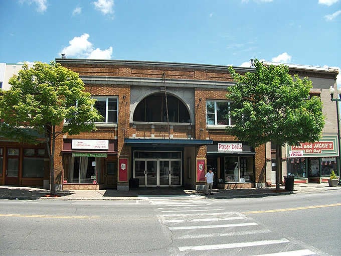 That grand arched entrance in Massena practically rolls out the welcome mat and hands you a reason to linger.