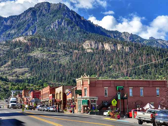 Mountains tower over these historic buildings like protective giants, creating one of Colorado's most dramatic small-town settings.