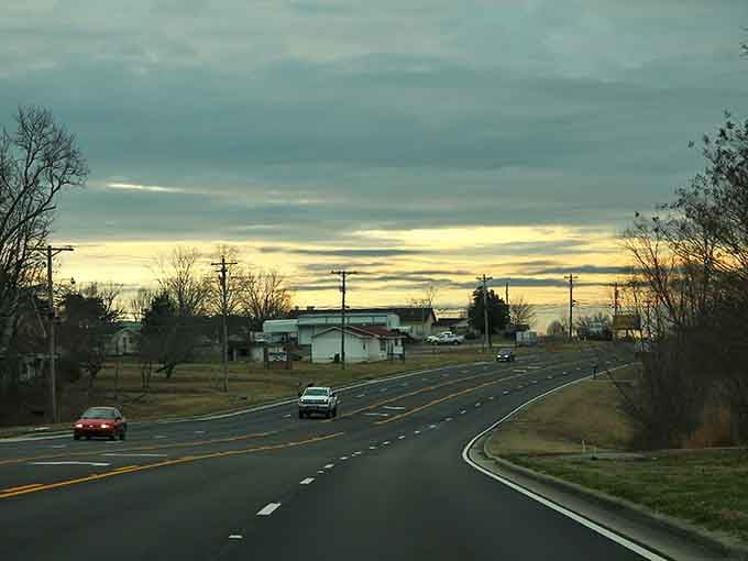 A golden sunset bleeds across the Rainsville horizon, turning an ordinary drive into something that feels almost cinematic.