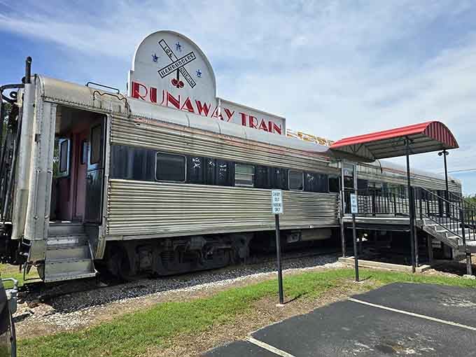 The corrugated steel sides and bold red lettering make this vintage railroad car look ready to roll straight into your heart.
