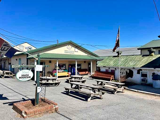 That welcoming South Mountain Creamery sign surrounded by picnic tables is a masterclass in farm-fresh hospitality done right.