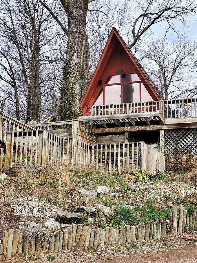 Even bare winter trees can't diminish the striking geometry of this blufftop A-frame beauty.