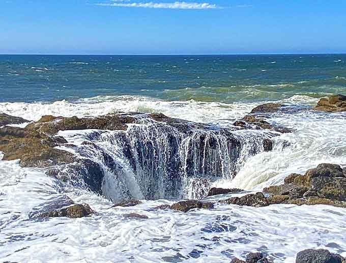 Water disappears into the depths of this coastal wonder, making you question where the ocean actually ends.