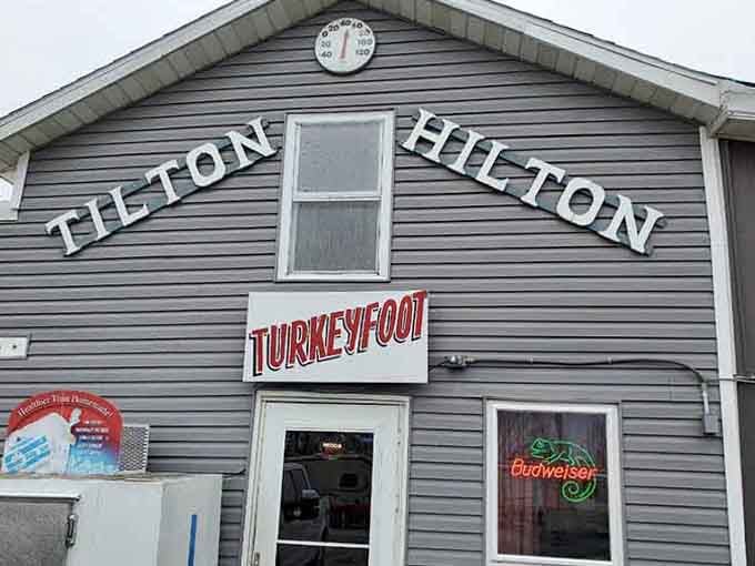 That rooftop thermometer watching over the Tilton Hilton parking lot suggests this place keeps tabs on everything, including your appetite.