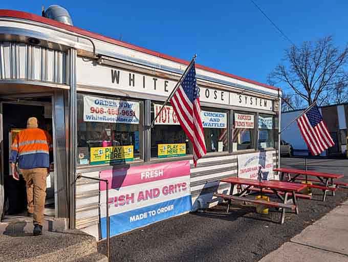 Those American flags waving proudly announce that this tiny treasure serves big flavors in a small, welcoming package.
