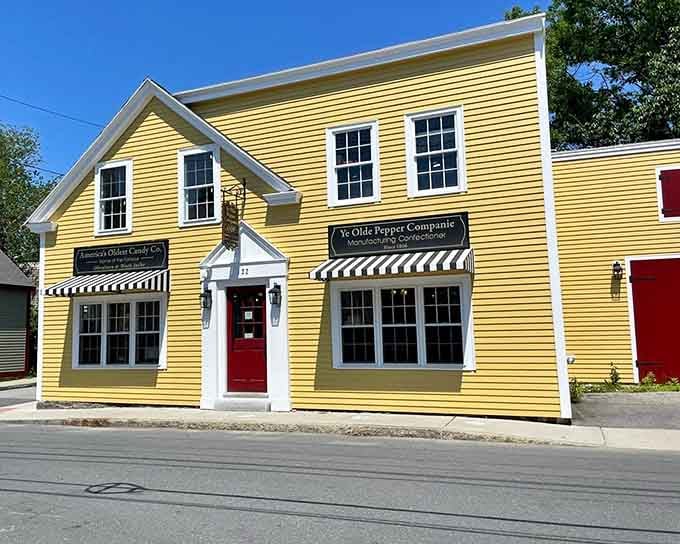Clean white trim, crisp striped awnings, and a bright red door &mdash; Ye Olde Pepper Companie means serious candy business.